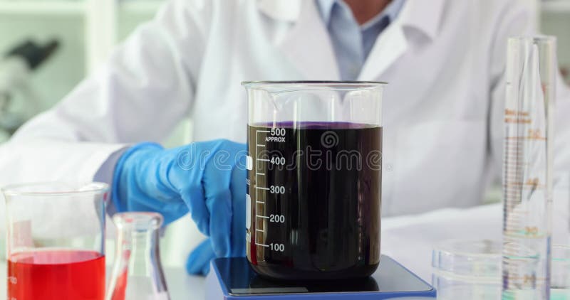 Scientist Flask with Boiling Black Solution in Lab Stock Footage ...