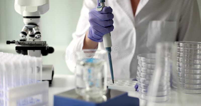The Scientist Gains Samples for the Analysis of Fluid, Close-up Stock ...