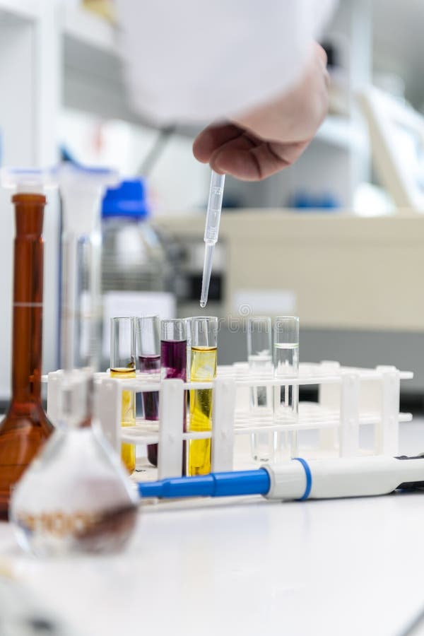 Hands with Dropper Examining Samples in Medical Laboratory, Stock Photo ...
