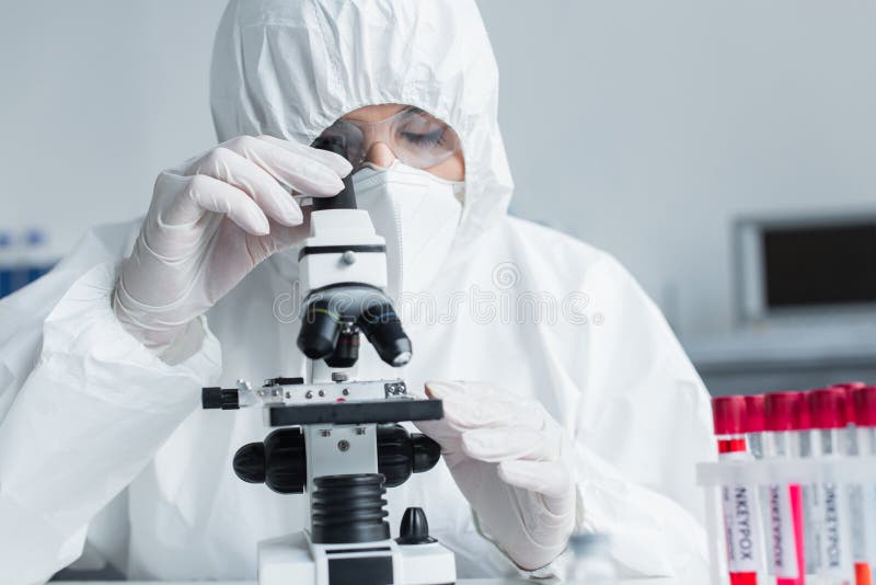 Scientist in Hazmat Suit Using Microscope Stock Photo - Image of blood ...