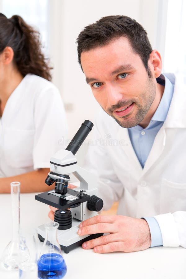 Scientist and Her Assistant in a Laboratory Stock Photo - Image of ...