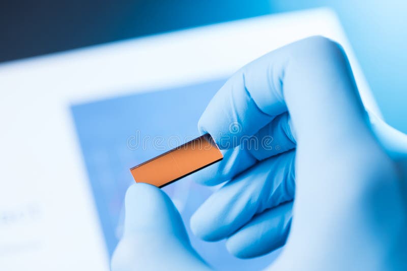 Scientist Hold in Hand Small Rectangle Tile of New Type Efficient Solar ... Scientist Hold in Hand Small Rectangle Tile of New Type Efficient Solar ...