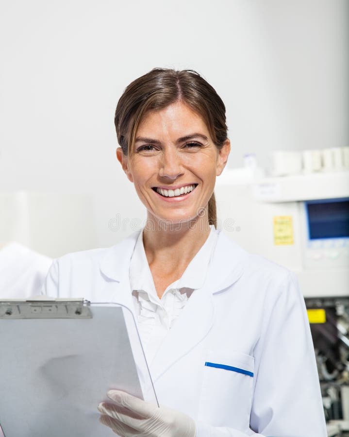 Scientist Holding Clipboard in Laboratory Stock Photo - Image of ...