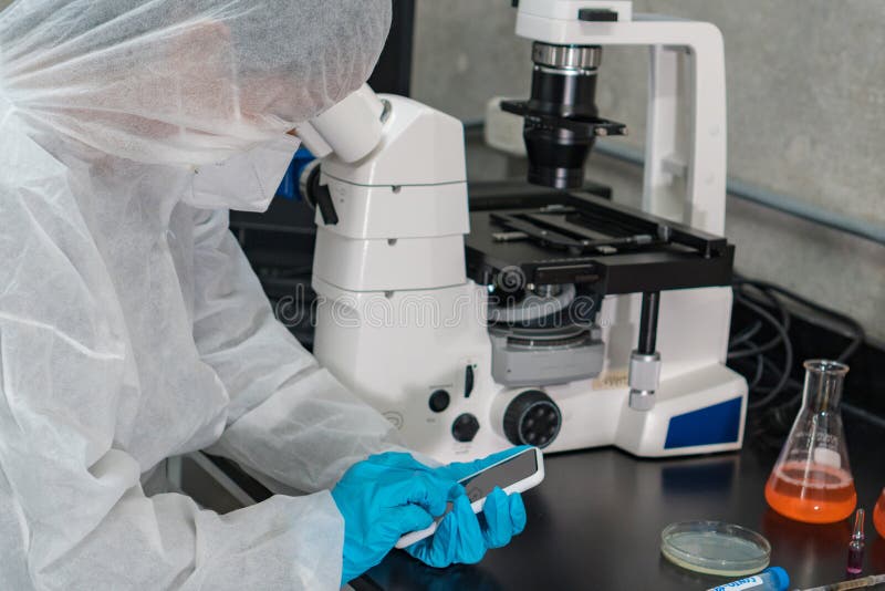 Scientist Holding Her Cell Phone in the Lab Stock Photo - Image of ...