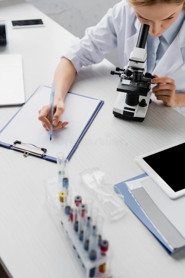 Scientist Holding Pen while Looking through Stock Image - Image of ...
