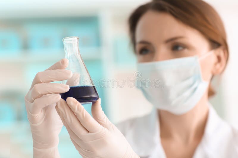 Scientist Holding Test Flask with Sample in Laboratory Stock Image ...