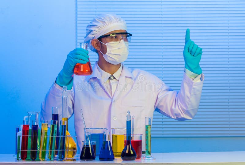 Scientist Holding a Test Tube with Liquid Stock Photo - Image of male ...
