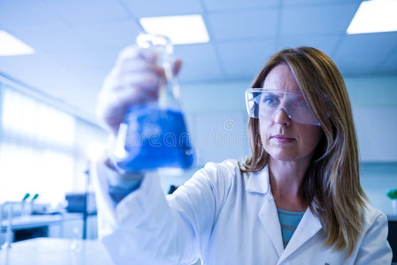 Scientist Holding Up Beaker of Chemical Stock Photo - Image of ...