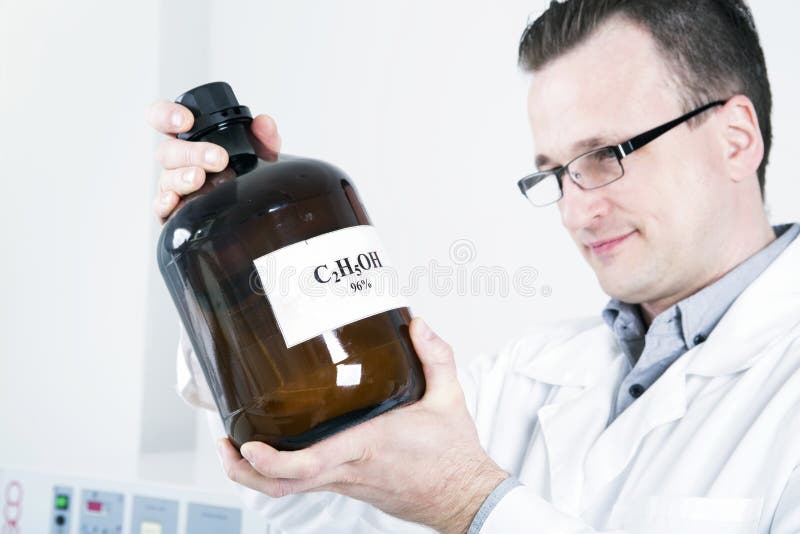 Scientist Holds Bottle in Laboratory Interior. Stock Photo - Image of ...