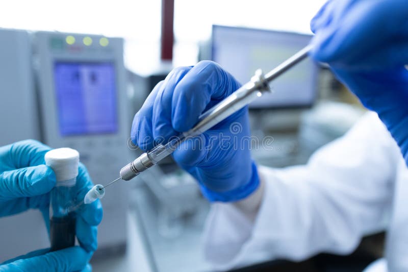 Scientist Injecting a Sample Via the Autosampler of HPLC System Stock ...