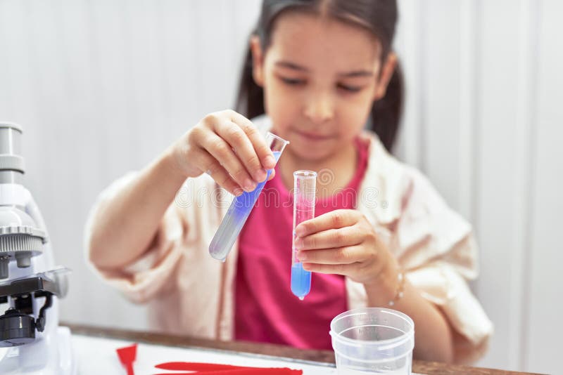The Scientist Kid Testing Chemistry Lab Experiment with a Microscope in ...