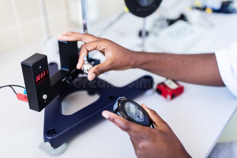 Scientist with Laboratory Clock and Timer Stock Image - Image of ...
