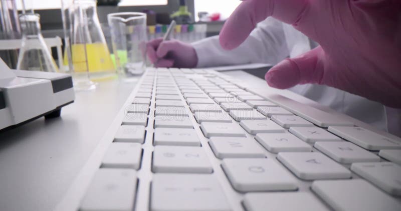 Scientist Laboratory Conducts Research Types Keyboard and Writes Down ...