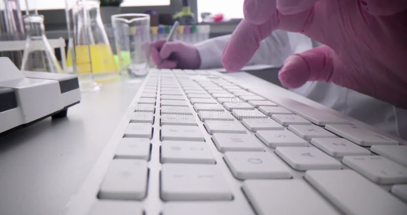 Scientist Laboratory Conducts Research Types Keyboard and Writes Down ...
