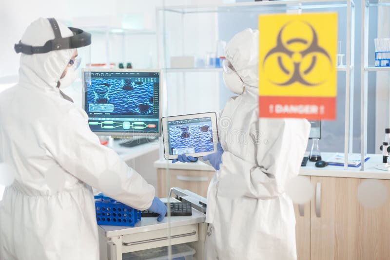 Scientist in Laboratory Danger Zone Using Tablet Pc Stock Image - Image ...