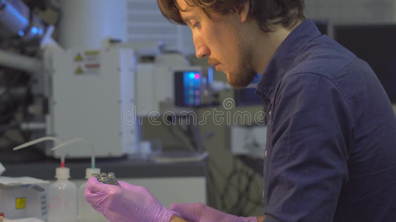 Scientist in a Laboratory Prepares Samples for Electron Microscopy ...
