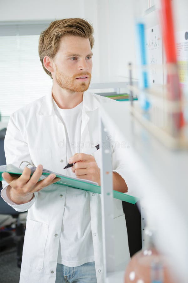 Scientist in Laboratory Taking Notes Stock Image - Image of small ...