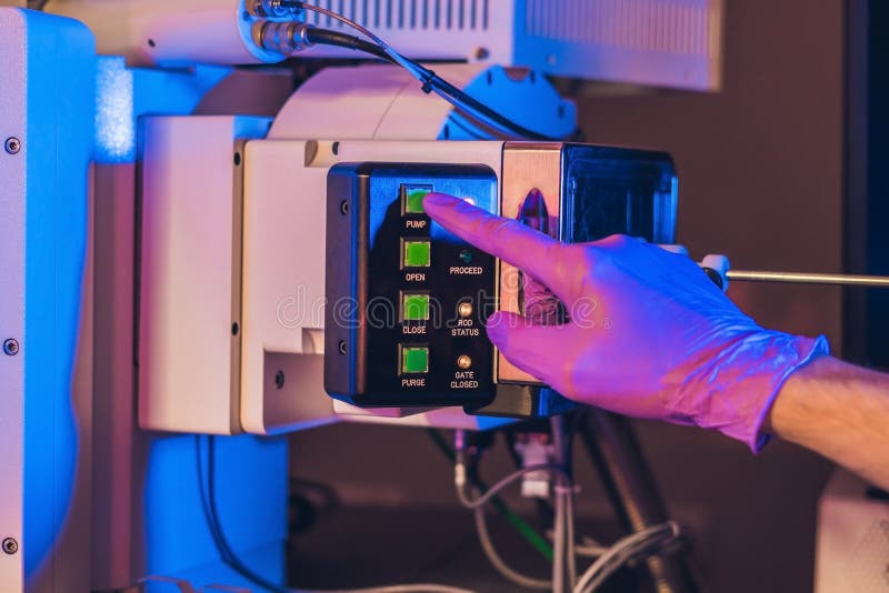 Scientist in a Laboratory Works with an Electron Microscope Gate Stock ...