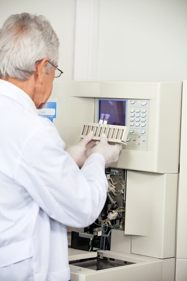 Scientist Loading Analyzer with Samples Stock Image - Image of ...