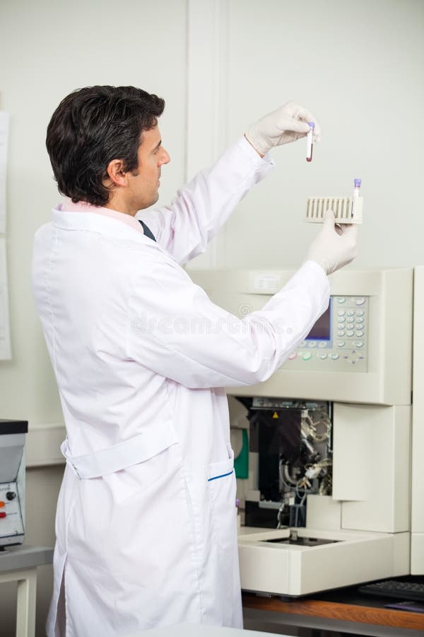 Scientist Loading Analyzer with Samples Stock Photo - Image of holder ...