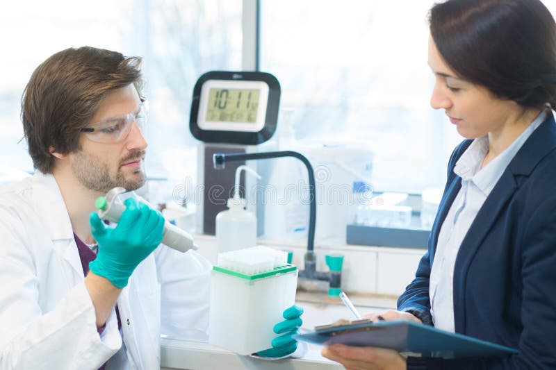 Scientist Loading Liquid Sample into Test Tube with Plastic Pipette ...