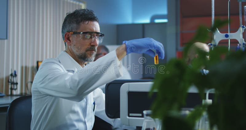 Scientist Loading Vials into a Testing Machine Stock Image - Image of ...