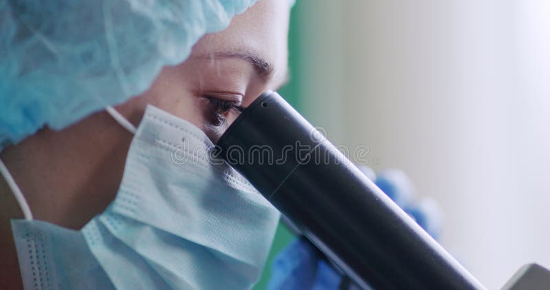 Female Scientist Looking into Microscope at Lab Stock Footage - Video ...