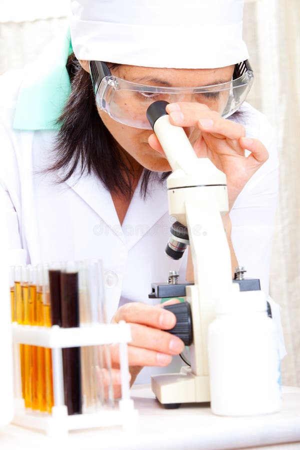 Scientist Looking into Microscope Stock Photo - Image of experiment ...