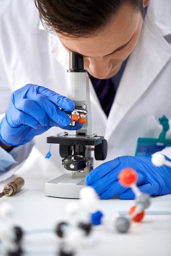 Scientist Looking through a Microscope Stock Image - Image of person ...