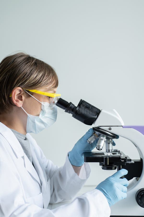 Scientist Looking through a Microscope Stock Image - Image of ...