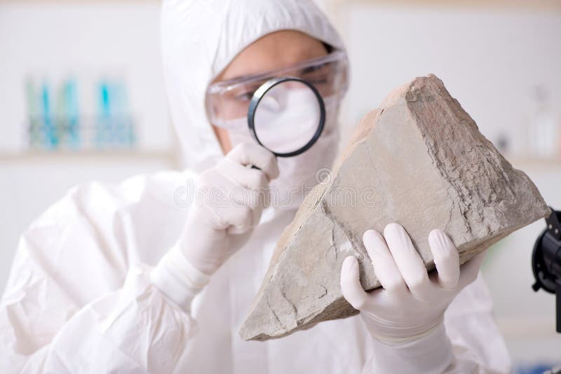 The Scientist Looking and Stone Samples in Lab Stock Photo - Image of ...