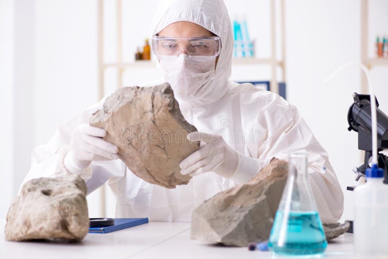 The Scientist Looking and Stone Samples in Lab Stock Photo - Image of ...