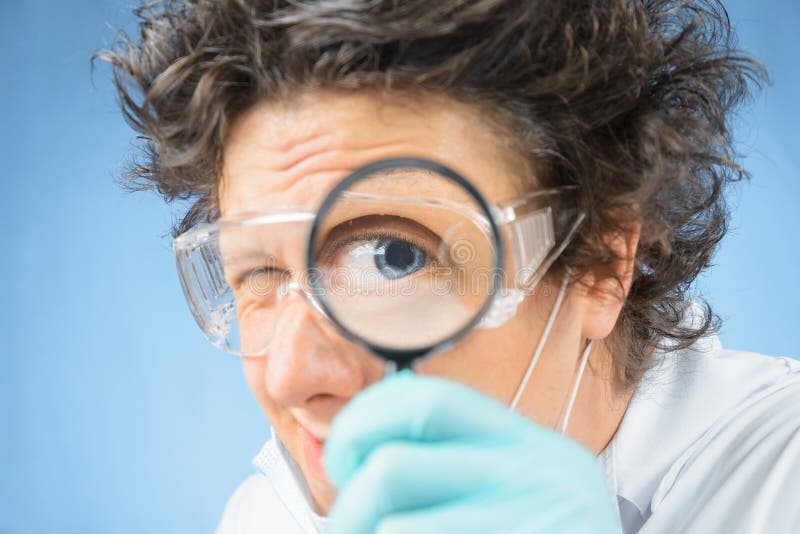 Scientist Looks through a Magnifying Glass Stock Photo - Image of ...