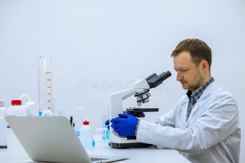 Scientist Man Doing Chemical Experiment, Making Analyzing, Looking ...