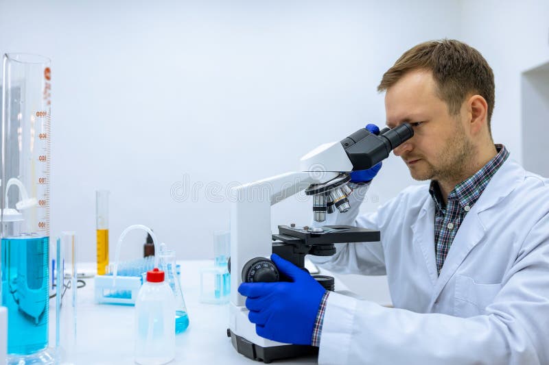 Scientist Man Doing Microbiology Experiment, Looking Sample Under ...