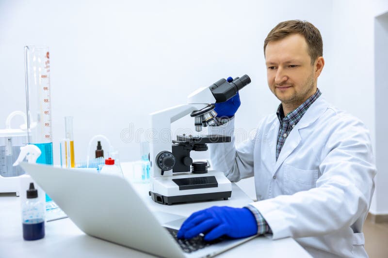 Scientist Man Doing Microbiology Experiment, Looking Sample Under ...