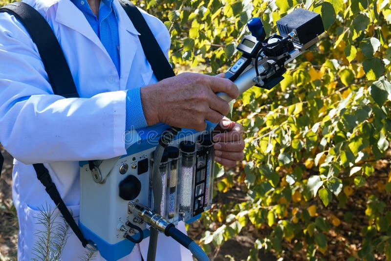 Scientist Measuring Plant Photosynthesis by Using Portable Device in ...