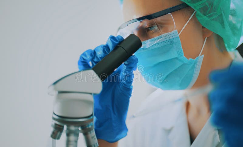 Scientist in Medical Mask Working with Microscope Stock Photo - Image ...