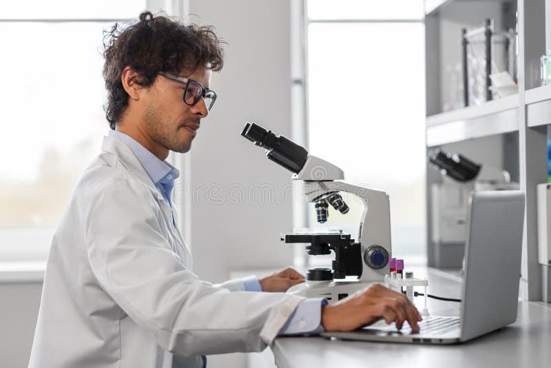 Scientist with Microscope Working in Laboratory Stock Image - Image of ...