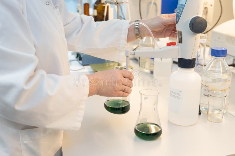 Scientist Mixing Liquids at the Lab Stock Image - Image of glove ...