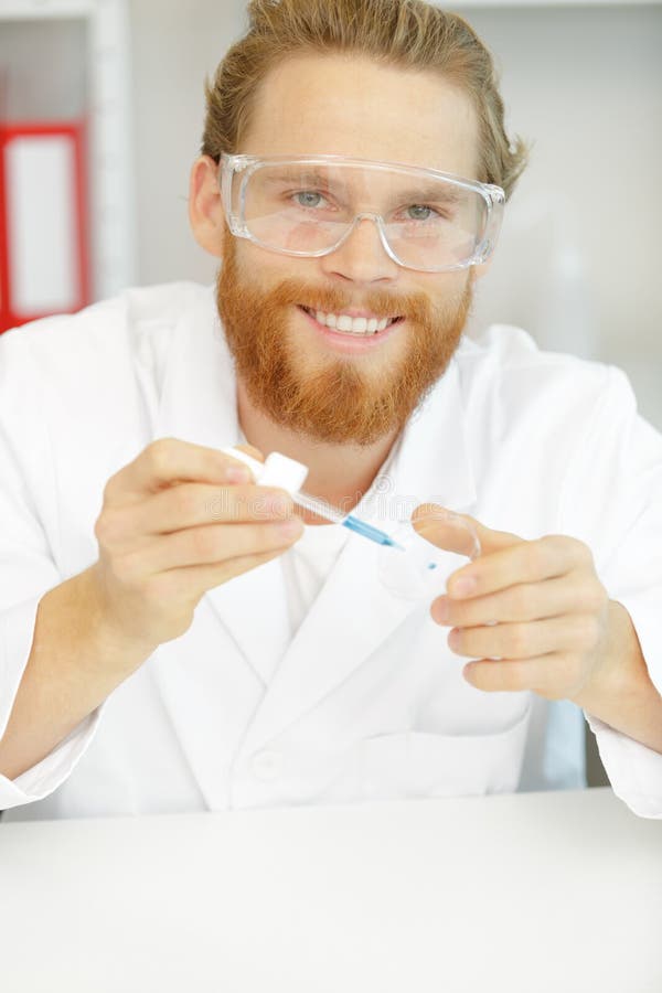 Scientist Mixing Reagents Making Tests in Lab Stock Photo - Image of ...