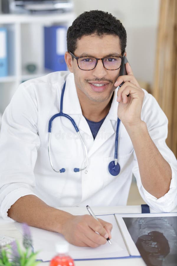 Scientist on Phone while Looking at Camera Stock Photo - Image of ...