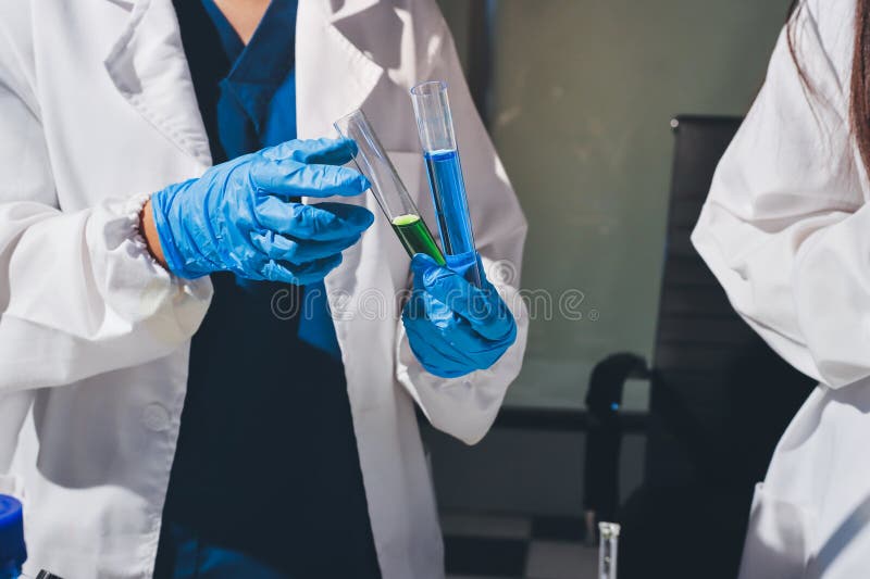 Scientist Pipetting Medical Samples into Microplate in Laboratory Stock ...