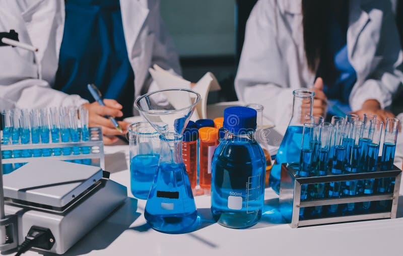Scientist Pipetting Medical Samples into Microplate in Laboratory Stock ...