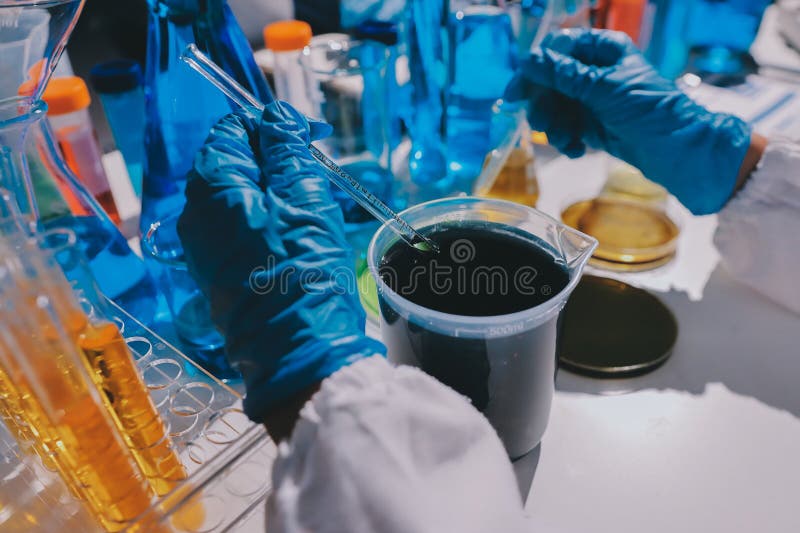 Scientist Pipetting Medical Samples into Microplate in Laboratory Stock ...