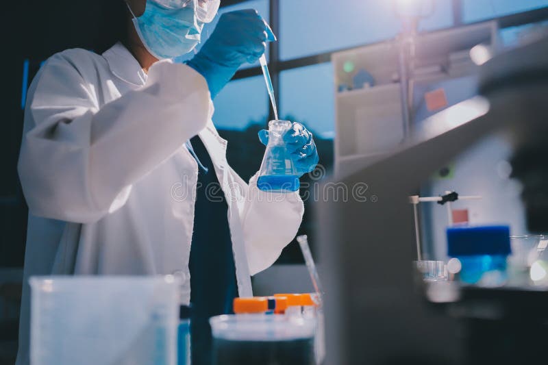 Scientist Pipetting Medical Samples into Microplate in Laboratory Stock ...