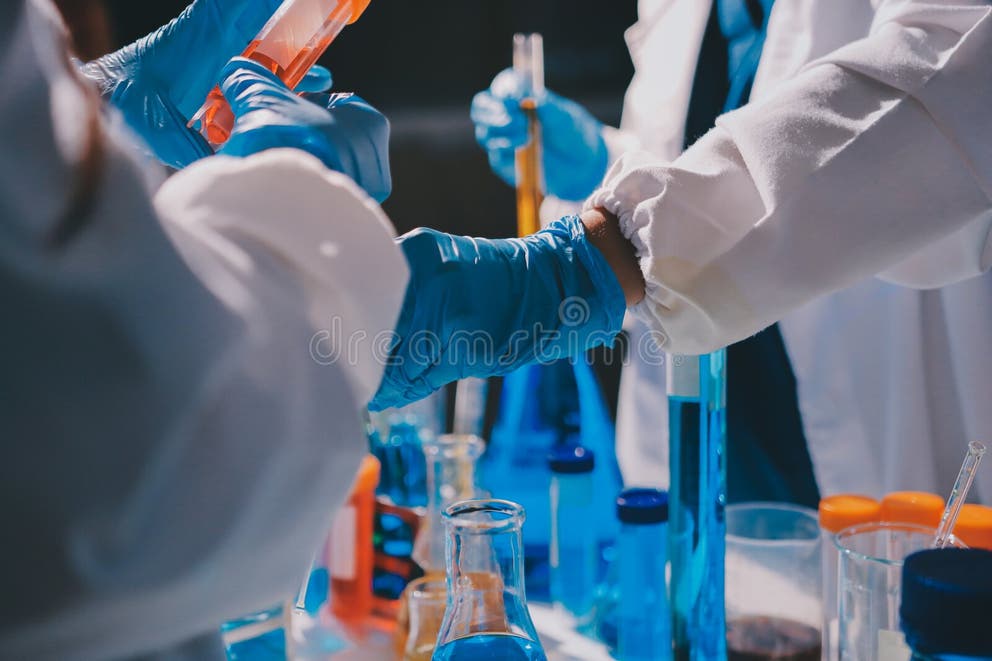 Scientist Pipetting Medical Samples into Microplate in Laboratory Stock ...