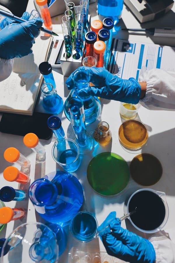 Scientist Pipetting Medical Samples into Microplate in Laboratory Stock ...