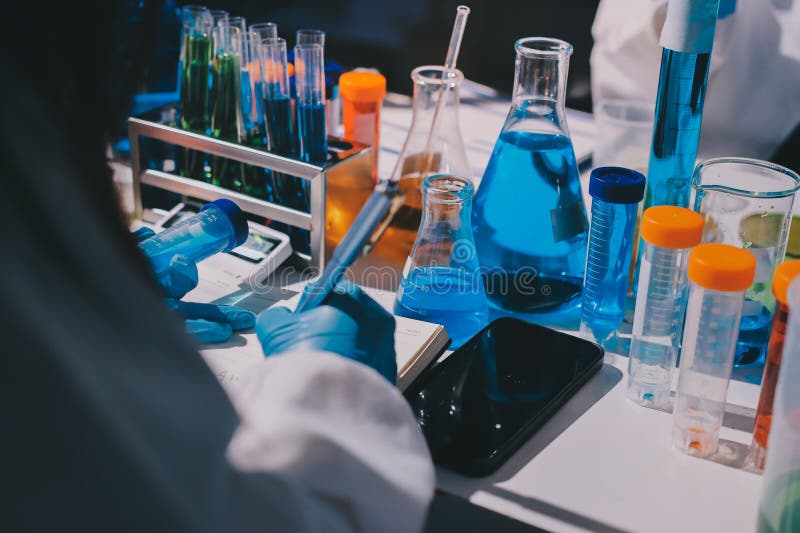 Scientist Pipetting Medical Samples into Microplate in Laboratory Stock ...