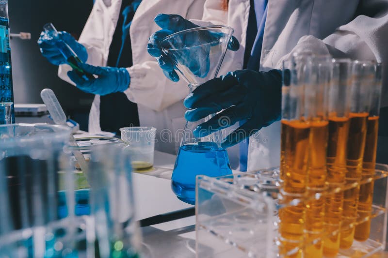 Scientist Pipetting Medical Samples into Microplate in Laboratory Stock ...